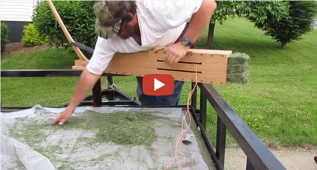 Mini Baler baling yard clippings from FarmShow magazine