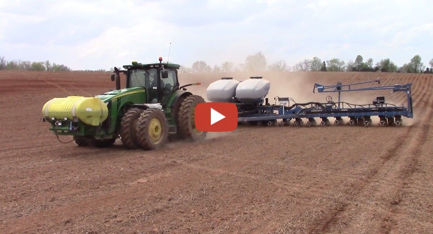 Kinze 4900 24 Row Corn Planter pulled by a John Deere 8285R