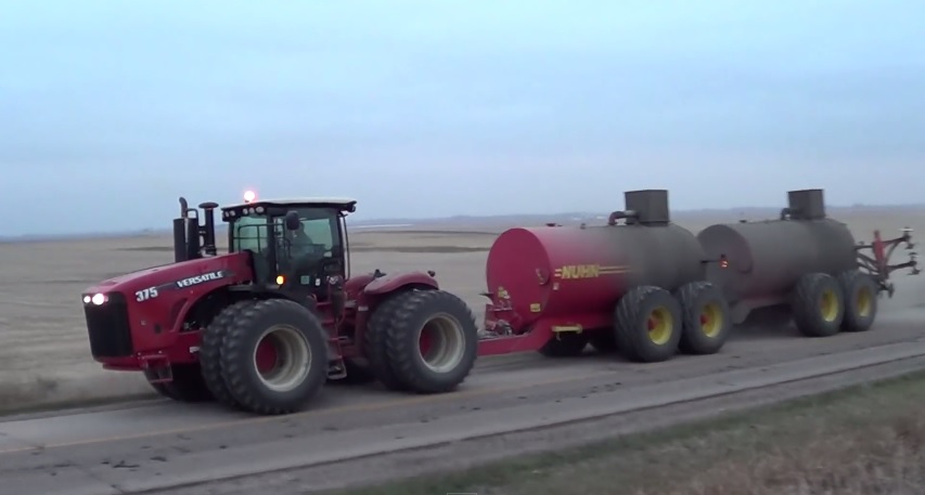 Two Versatile 375 Tractors pulling Nuhn Manure Tankers in Iowa