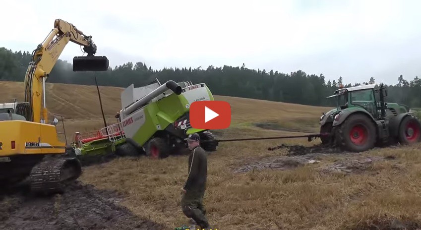 Claas combine stuck in the mud. Who will get him out