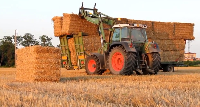 Loading Bales of straw.