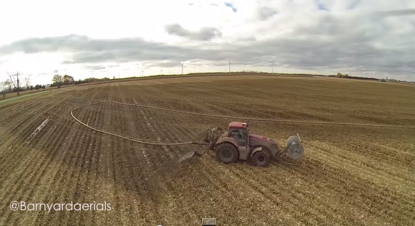 Magnum Spreading Manure with drag line. (Barnyard Aerials)