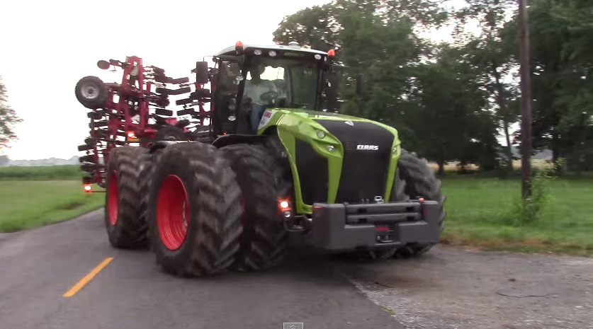 The new CLAAS XERION 5000 Tractor is a 517 hp ridged frame tractor with ...