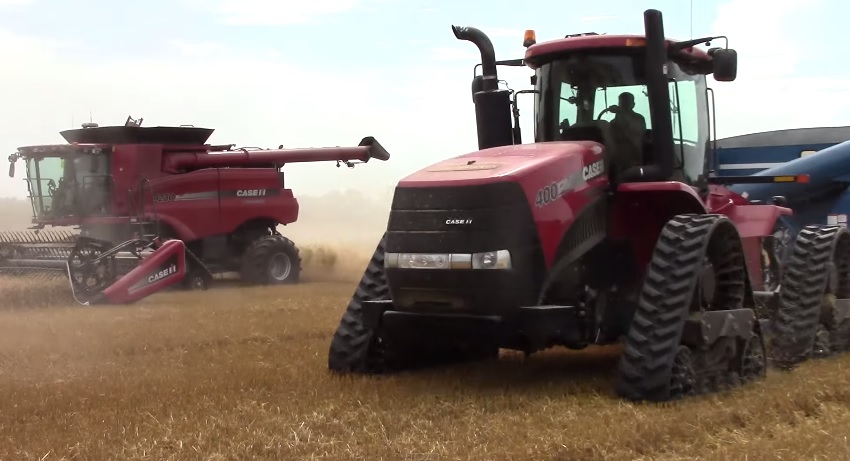Four Case IH 230 Series Axial-Flow combines on tracks harvesting the ...