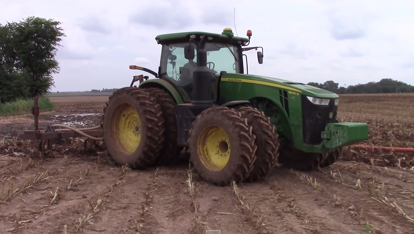A John Deere 8245R Tractor applying manure following the 2015 silage ...