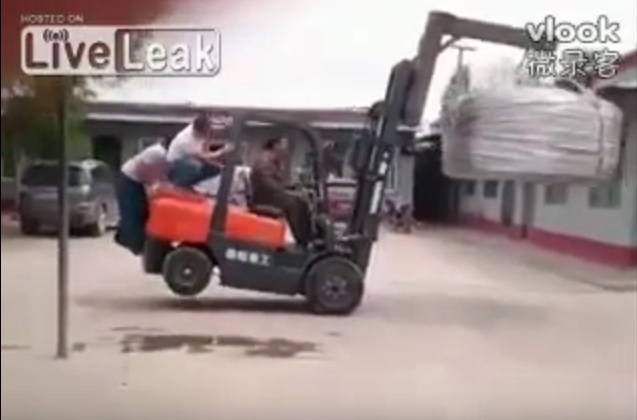Workers fail to counterbalance forklift to lift heavy load
