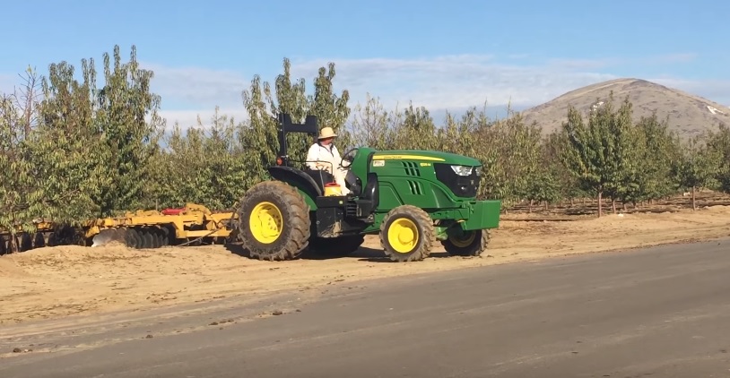 Powerful John Deere 6125M Low Profile. Domries Tandem disk