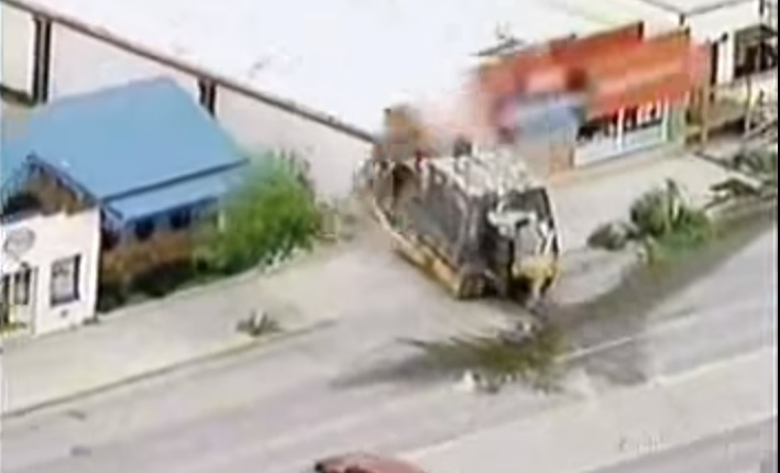 An angry man goes on a rampage in his home-made bulldozer, and ...