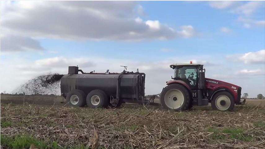 Versatile 310 tractor pulling a liquid manure tanker hauling how manure ...