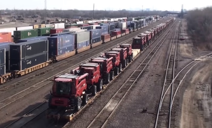Case IH Combines on Train, Chicago Skyline