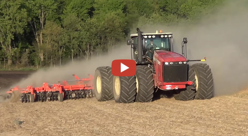 Working ground in the spring with a Versatile 575 Tractor pulling a ...