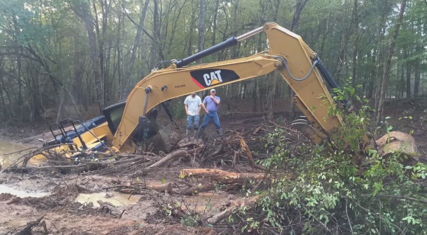 Stuck Trackhoe Excavator Buried Rental Disaster Caterpillar