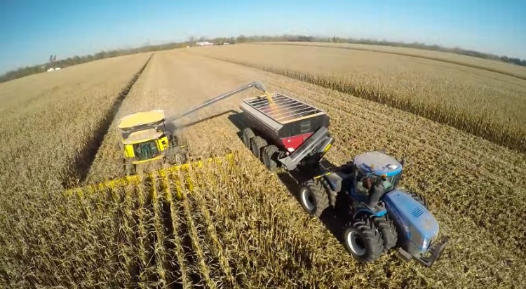 New holland combine with 16 row corn head. The grain cart is one of the ...
