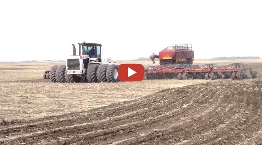 Big bud 525/50 tractor pulling an 84' Seedhawk drill near Guernsey Sk