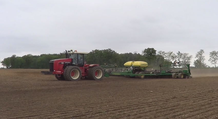 Versatile 340 tractor pulling a 60 foot John Deere planter planting ...
