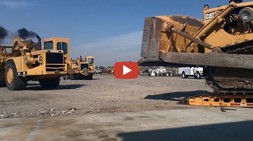 Cat Guts. Pushing the D9 on the lowboy and tearing down the final drive