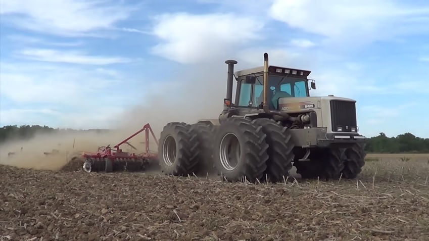 Agcostar 8425 Tractor pulling a Sunflower VT Disk and Brillion Packer ...