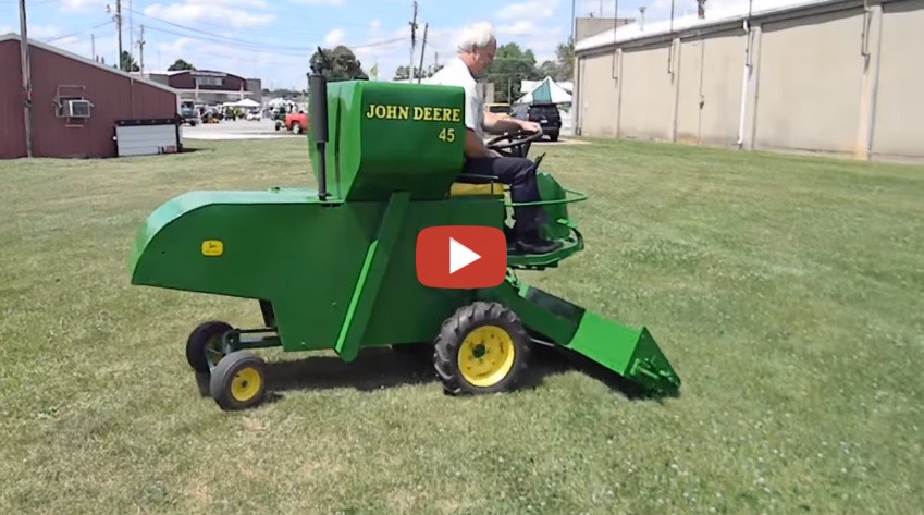 A miniature John Deere combine made from a Simplicity mower.