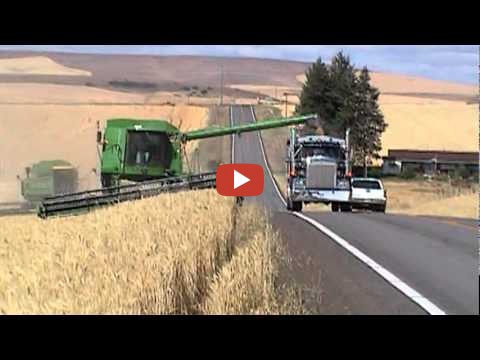 John Deere Combine Unloading On Go - Highway