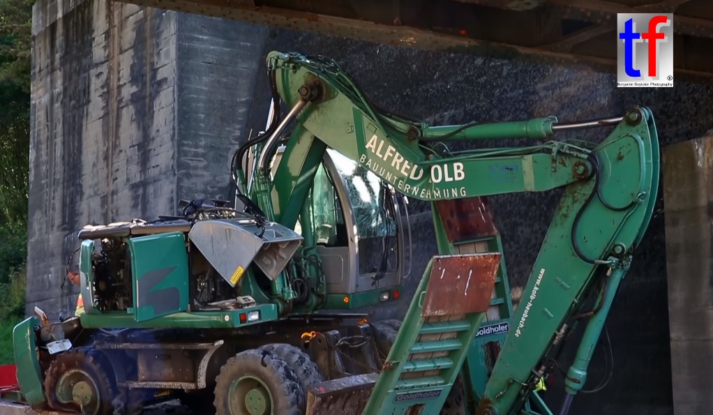 Excavator on Trailer hits Train Bridge