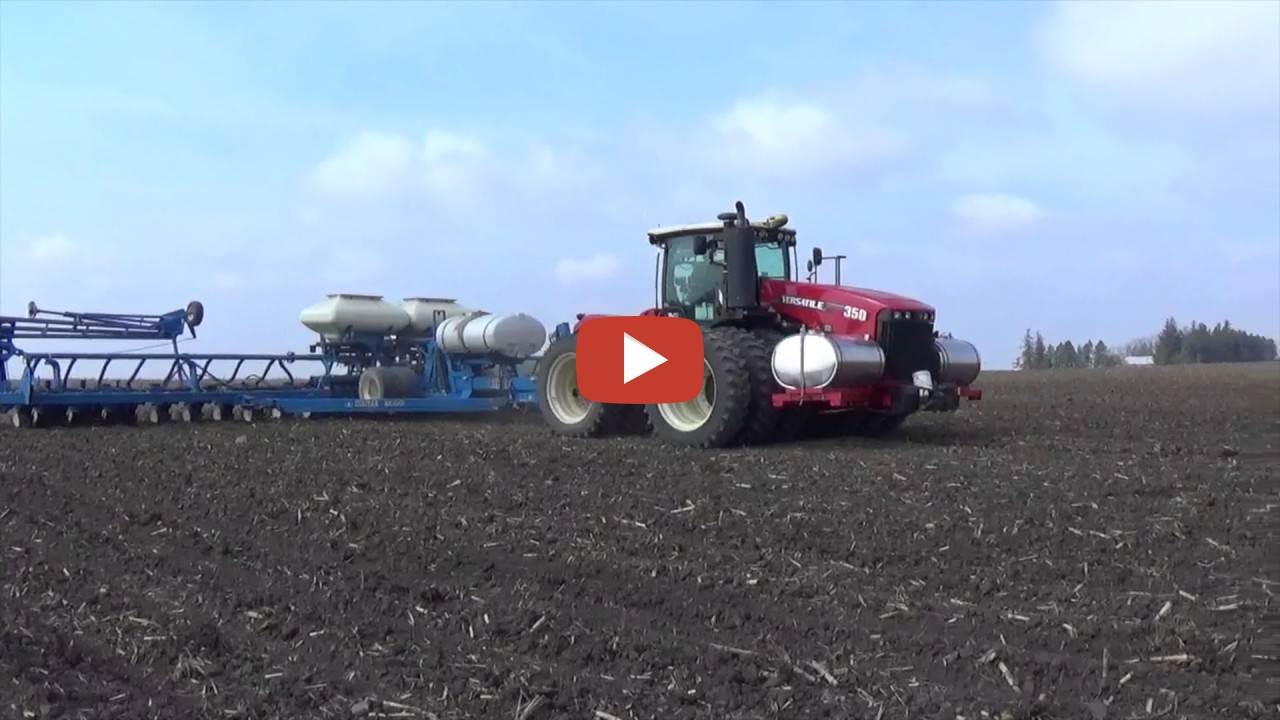 Versatile 350 Tractor pulling a 24 row Kinze 3800 series planter ...
