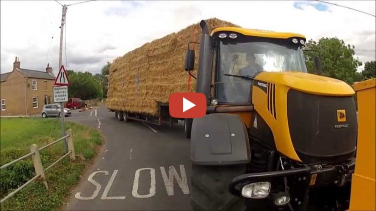 JCB fastrac 3230 carting a load of wheat straw.