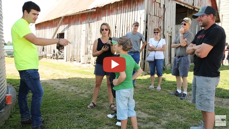 Ryan is talking with people on the How Farm work Farm day..........