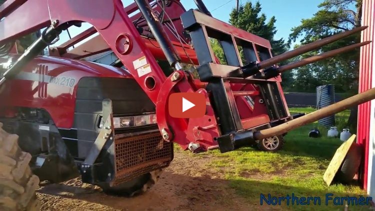 Northern farmer is showing the 'new' bale fork