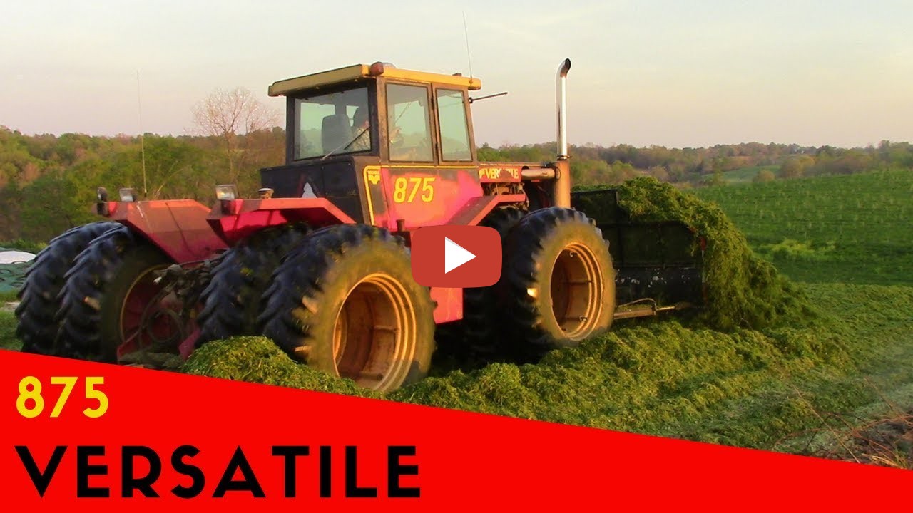 Versatile 875 4wd Tractor 280 HP engine pushing silage -- bigtractorpower