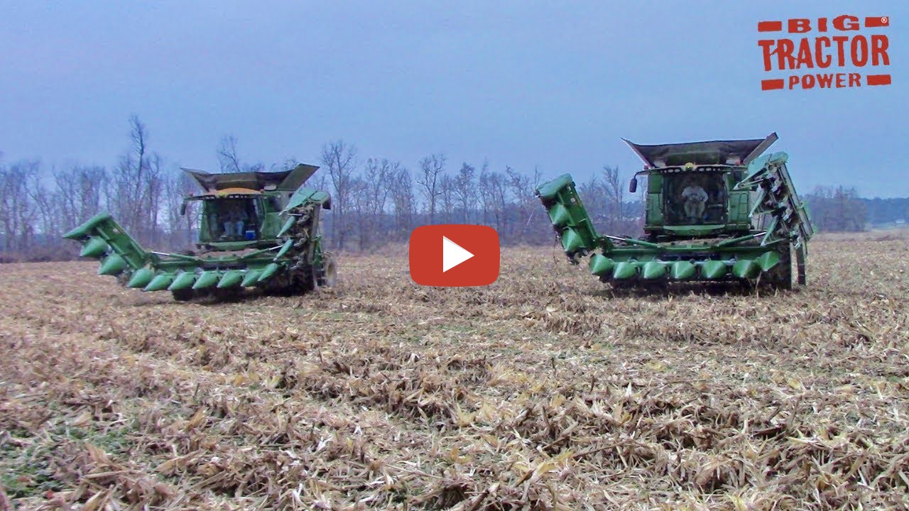 Western Kentucky corn field with two John Deere S770 combines equipped with John Deere 712FC ...