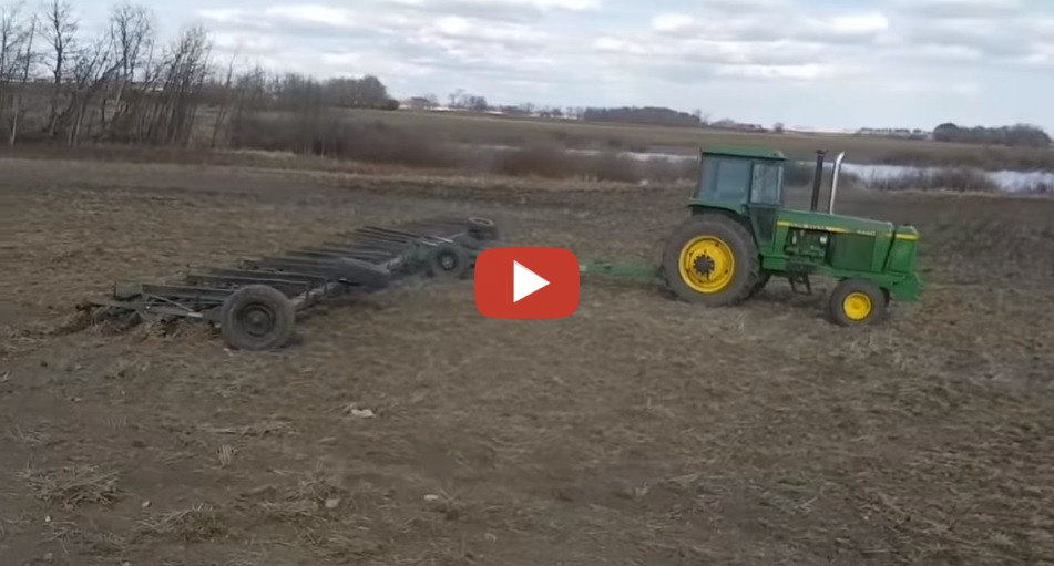 Harrowing wheat stubble with the John Deere 5020!! -- south sask farmer