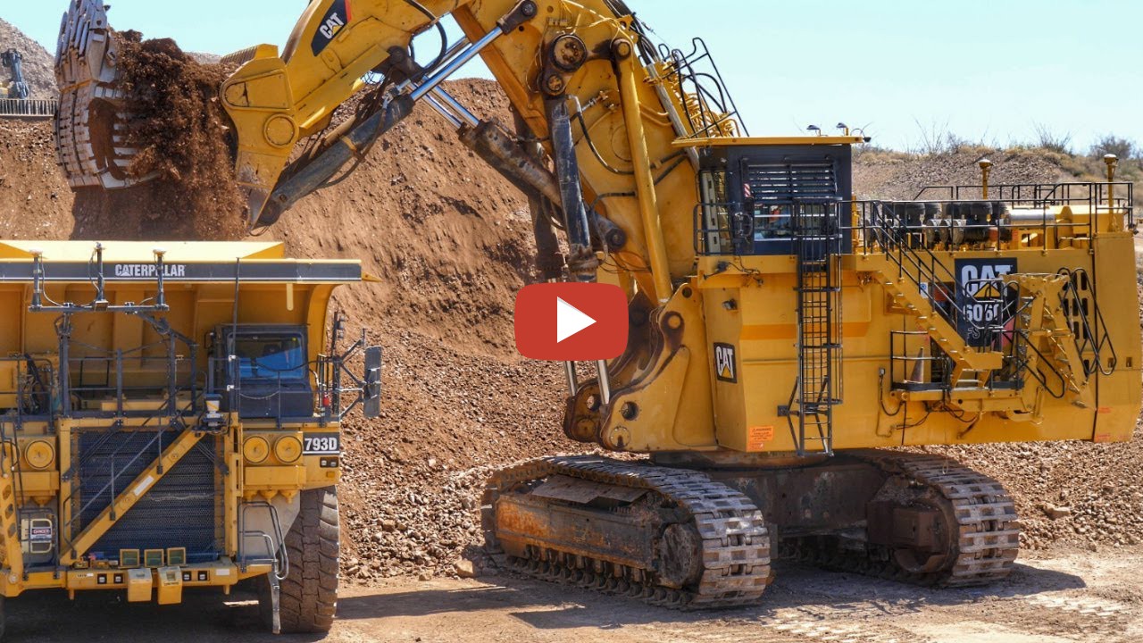 Caterpillar 6060 Face Excavator loading Autonomous Trucks The ...