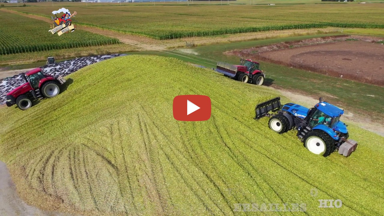 Having a little fun on the farm. Watch the guy running the Blue Tractor ...