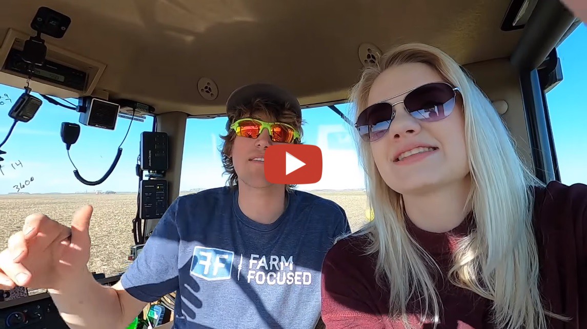 Larson Farms -- Nikki comes out to visit Chet in the planter tractor ...