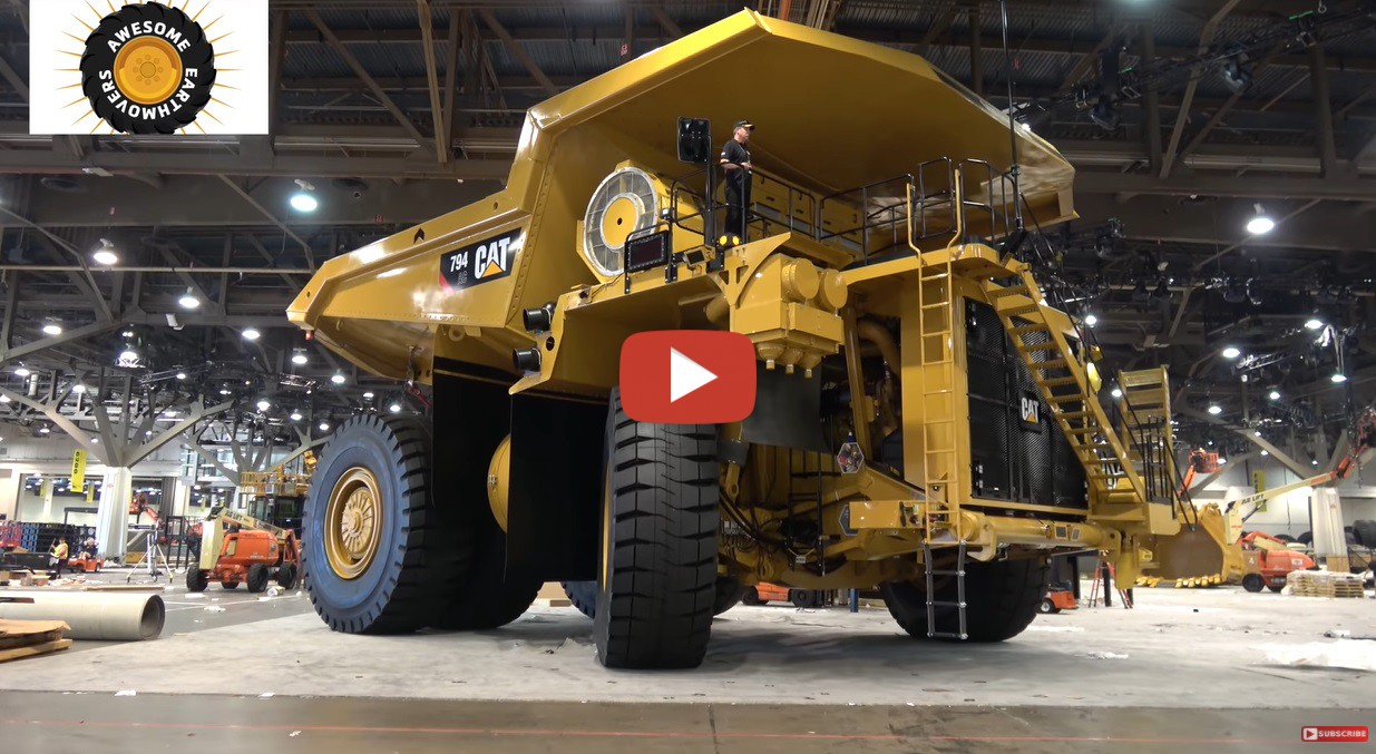 Moving a massive Caterpillar 794AC dump truck - Caterpillar displayed ...