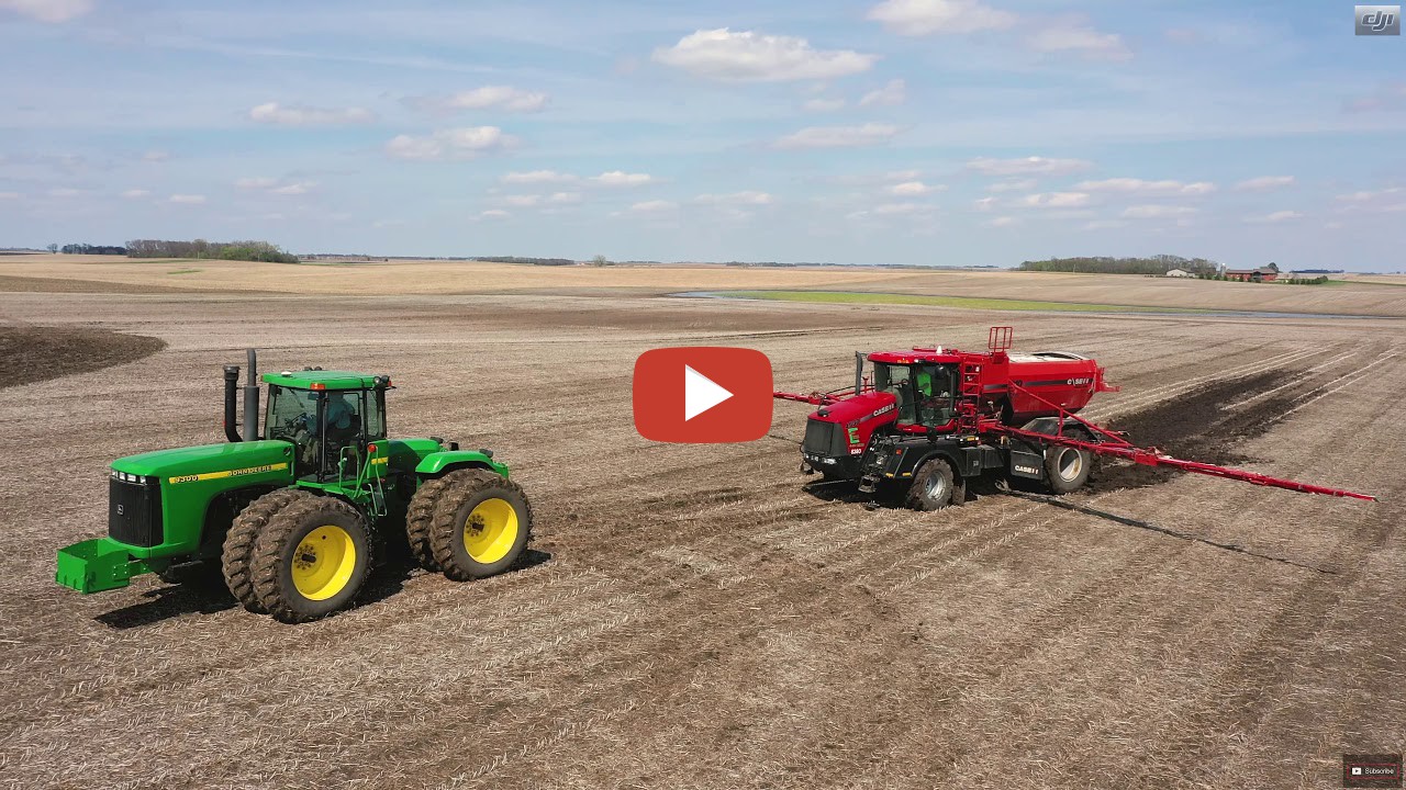 John Deere pulling Case IH out of the mud. - Nothing like some green ...