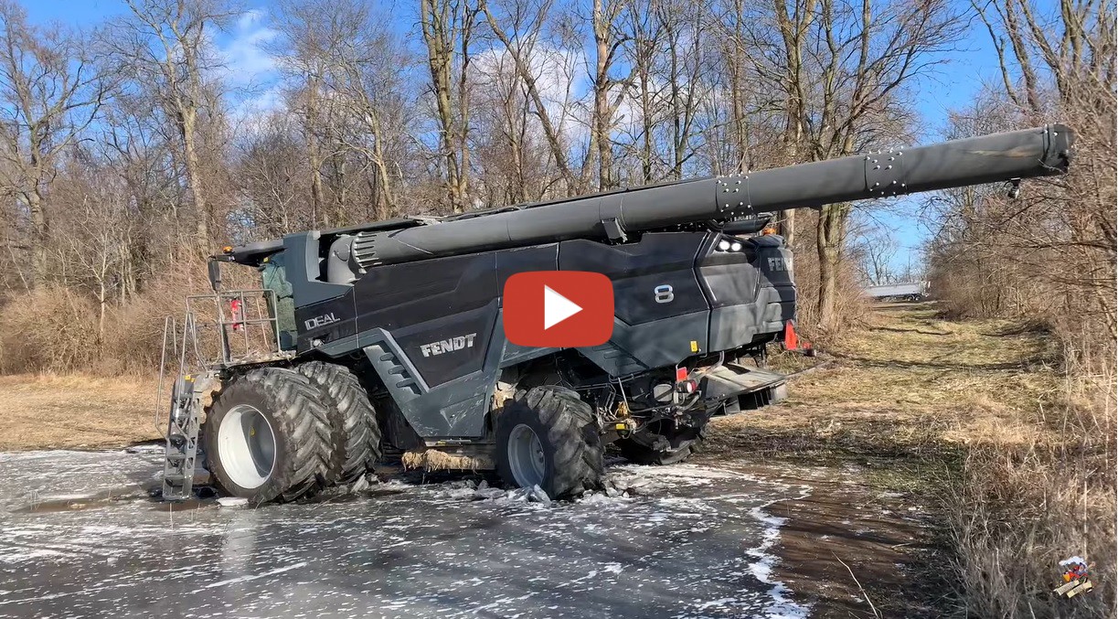 Mike Less -Two different combines as they harvest a field that has corn ...