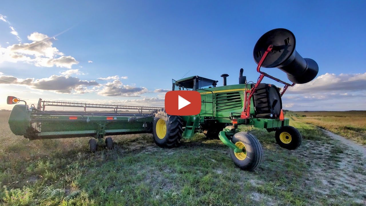 Mike Mitchell -- Mike bought a used John Deere D450 swather last winter ...