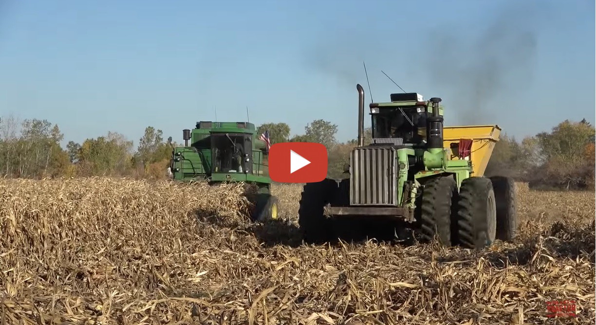 bigtractorpower 2022 is in the field with a pair of JOHN DEERE Titan combines harvesting corn.