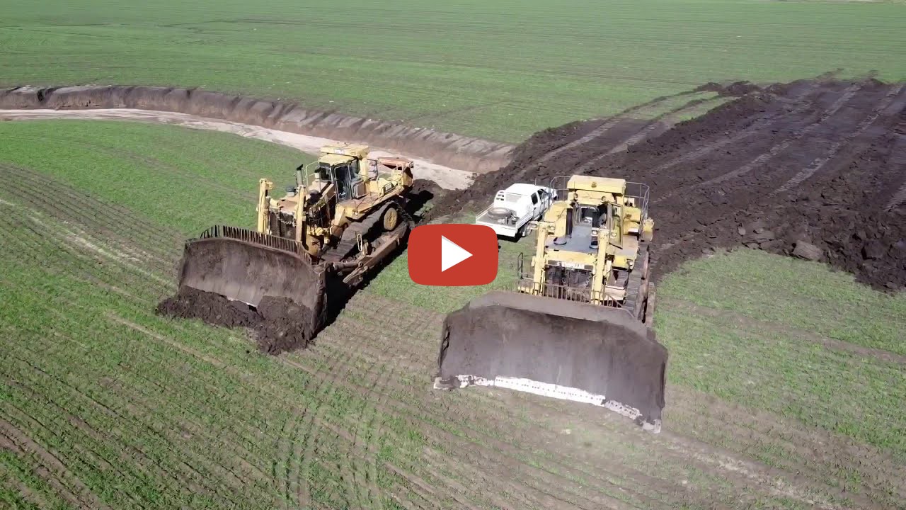 Big D11 bulldozers at work on farm -- Fixing flood erosion and making ...