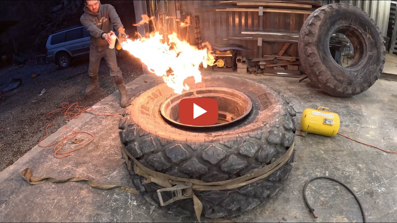 Installing 2 new 23.1-26 tires on a Galion 84 inch roller. -- Andrew ...