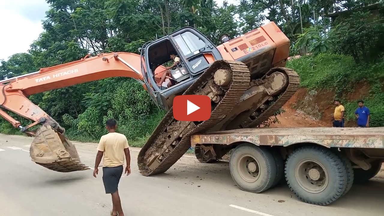 Loading a Hitachi 210 Excavator..
