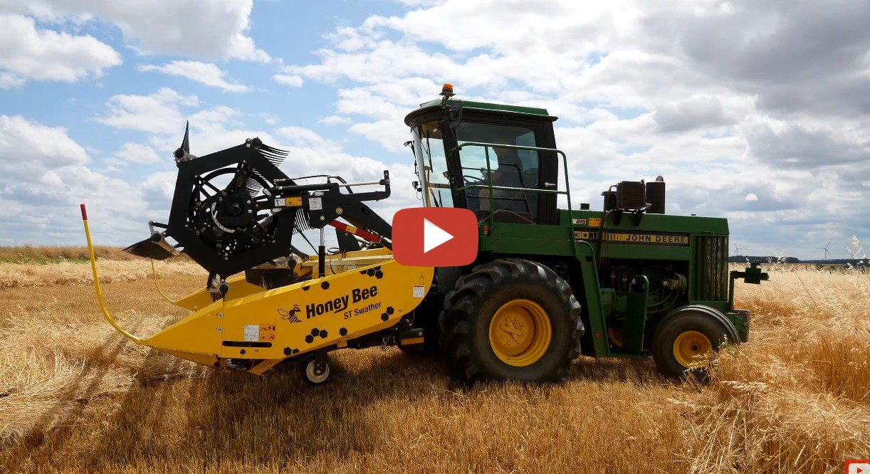 Old timer John Deere 5830 with a Honey Bee ST Swather -- Mathieu-agri 57