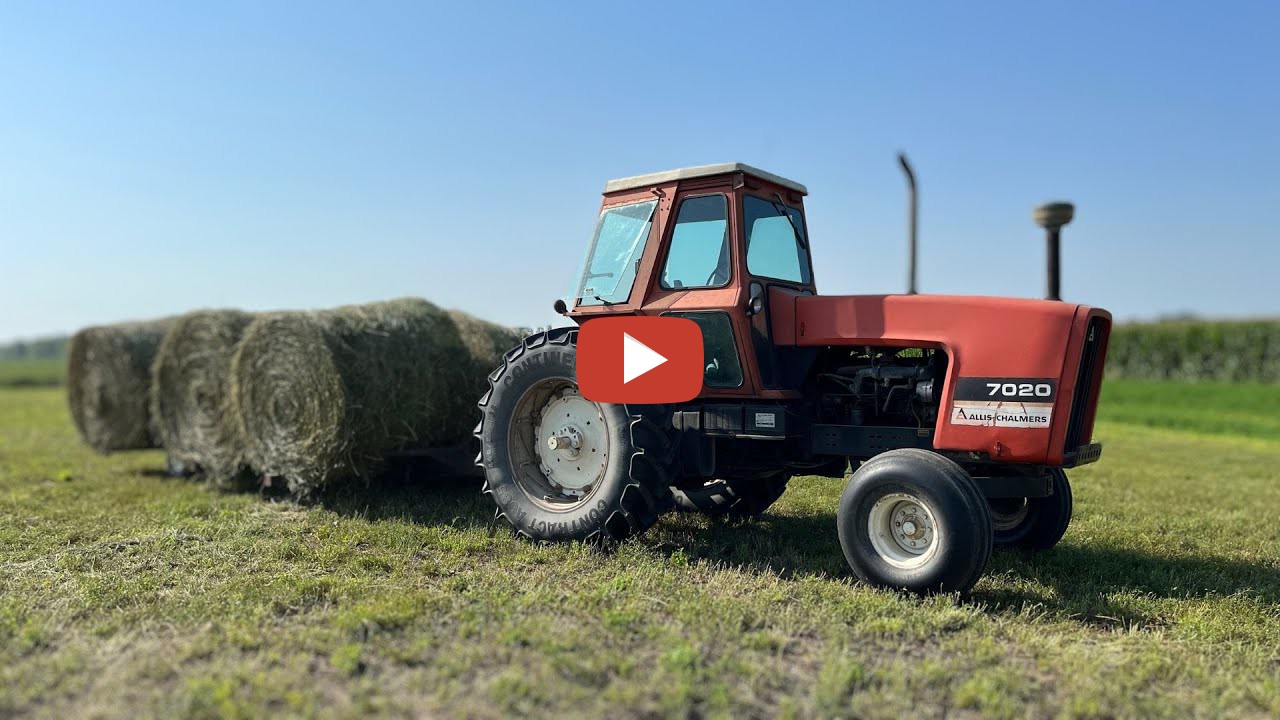 Iowa Country Girl -- Today we moved round bales before it got really hot!