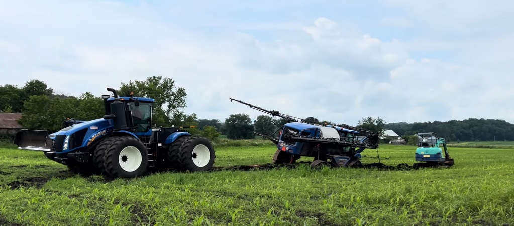It's a bad day when your sprayer gets stuck in the mud this bad..-- New ...